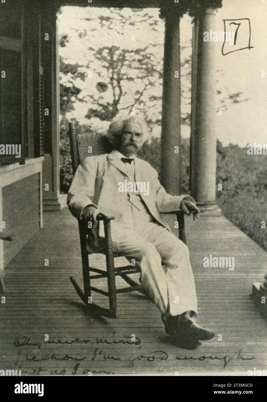 American writer Mark Twain sitting in a chair in the porch, USA 1900s ...
