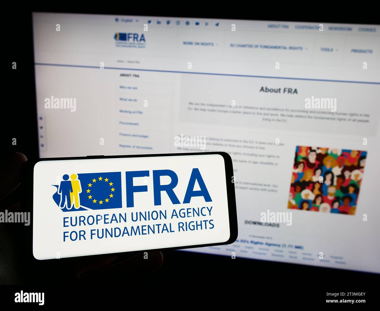 Person holding mobile phone with logo of European Union Agency for ...