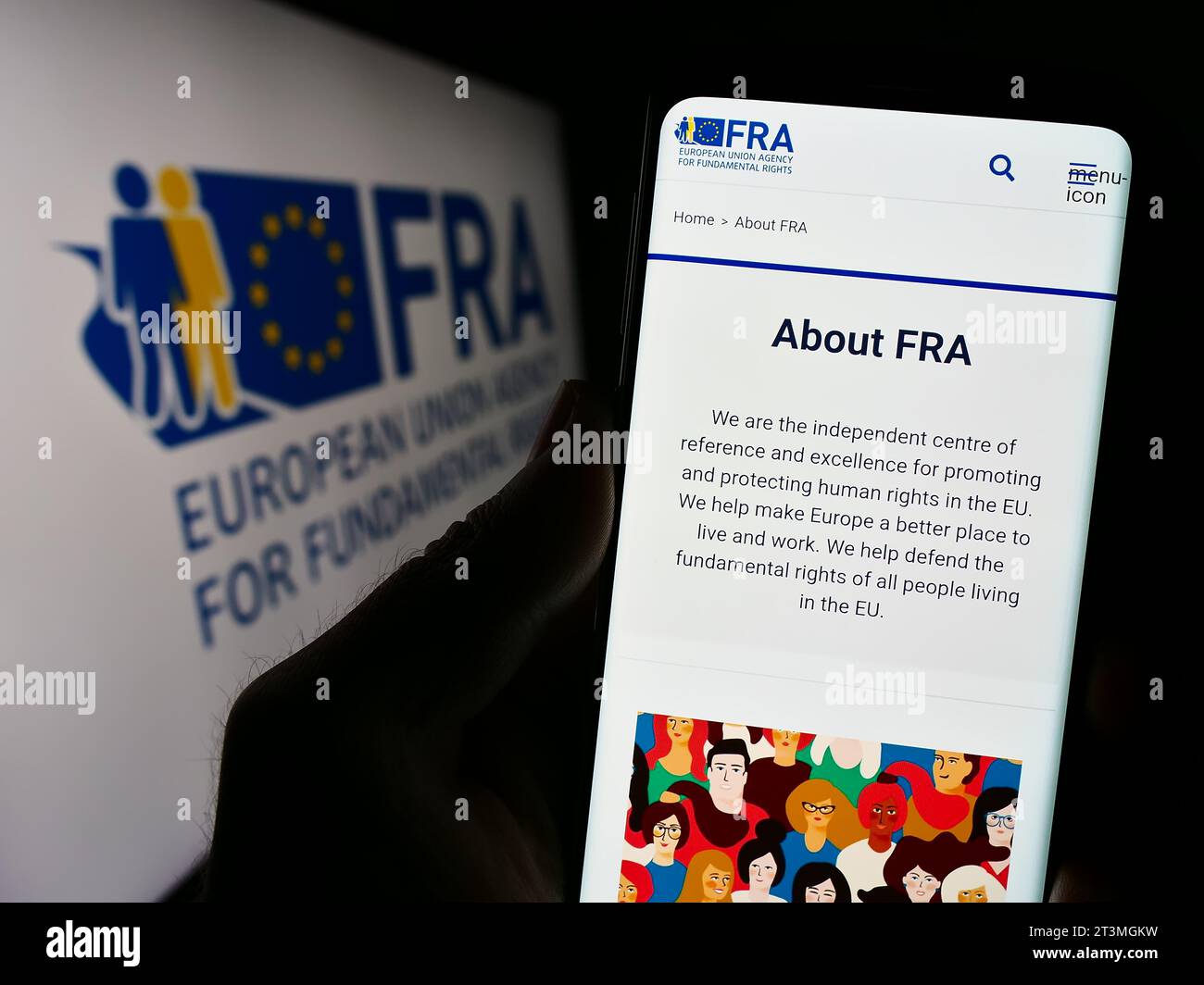 Person holding cellphone with webpage of European Union Agency for ...