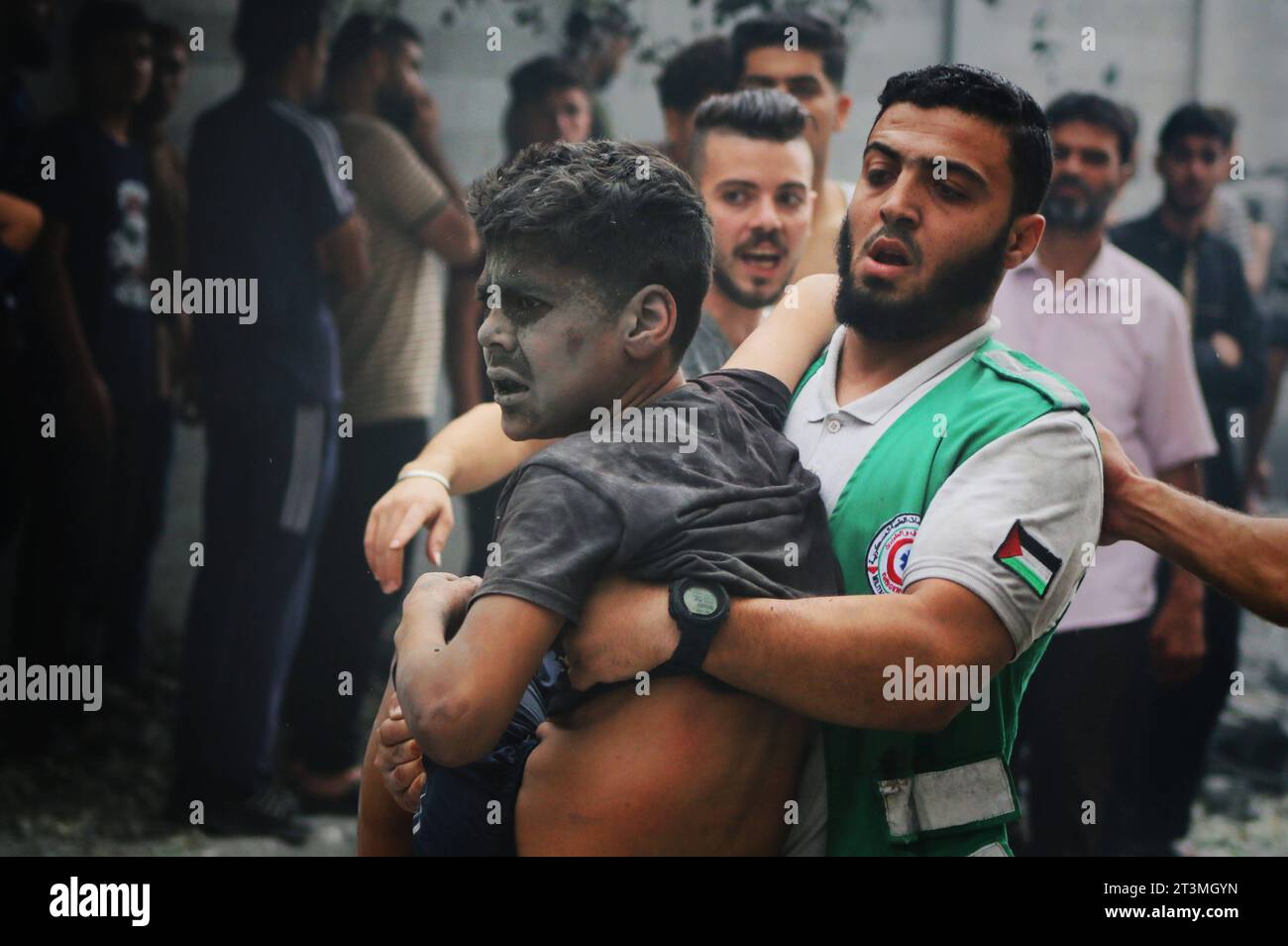 Palestinian Civil defense teams and civilians try to rescue people ...