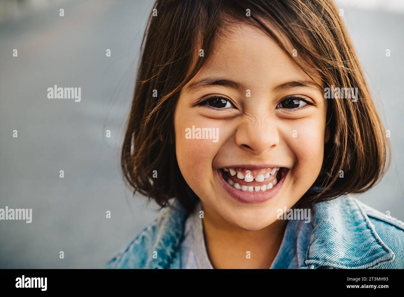 Happy child having fun smiling into the camera Stock Photo - Alamy