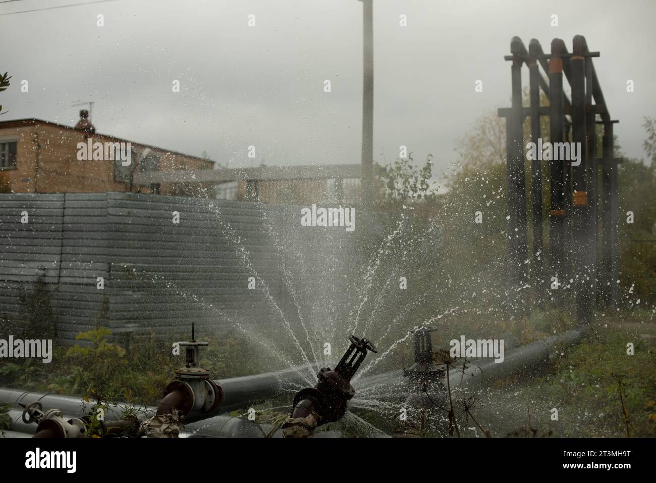 Pipeline accident. Boiling water pours from pipe. Boiler room emergency ...