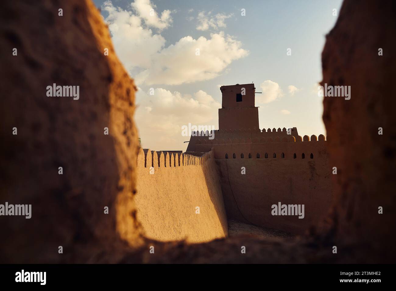 Sunset at the walls of the ancient fortress of Kunya Ark with tower at ...