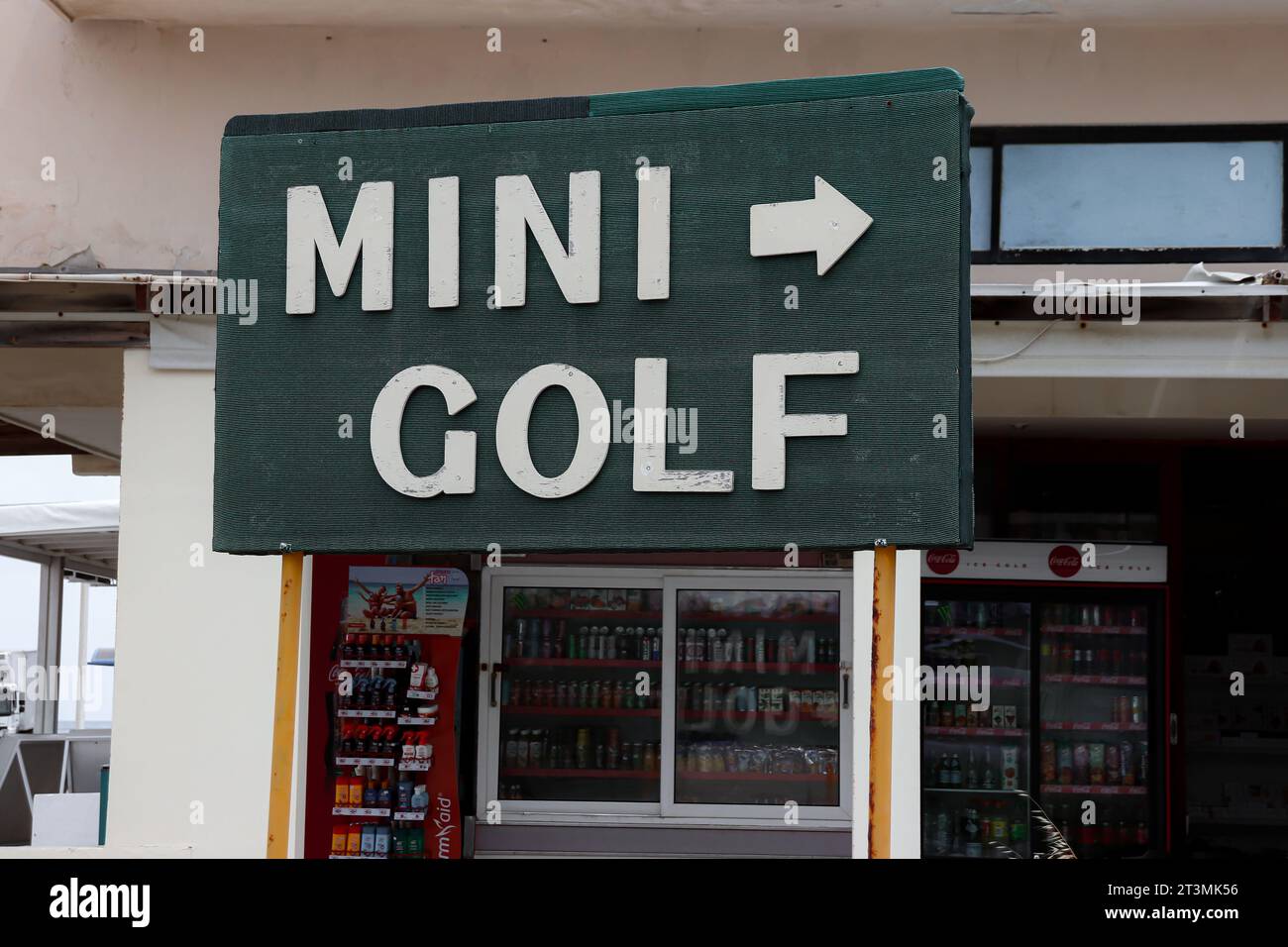 Mini Golf sign pointing to the direction where the attraction sport ...