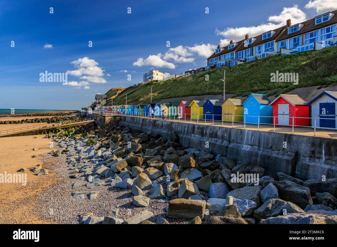 A row of colourful beach huts on the sea wall at Sheringham, Norfolk ...