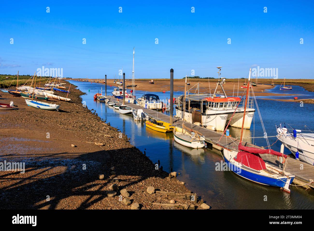 A mixture of colourful leisure and fishing boats berthed alongside the ...