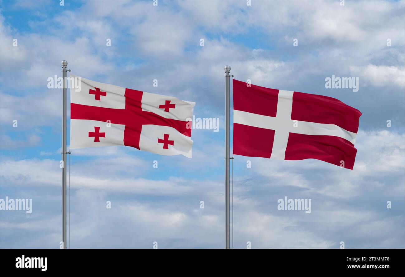 Denmark and Georgia flags waving together on blue cloudy sky, two ...