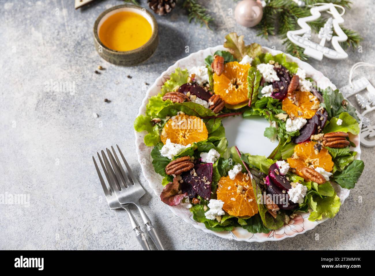 Christmas appetizer. Christmas wreath salad with beetroot, tangerines ...