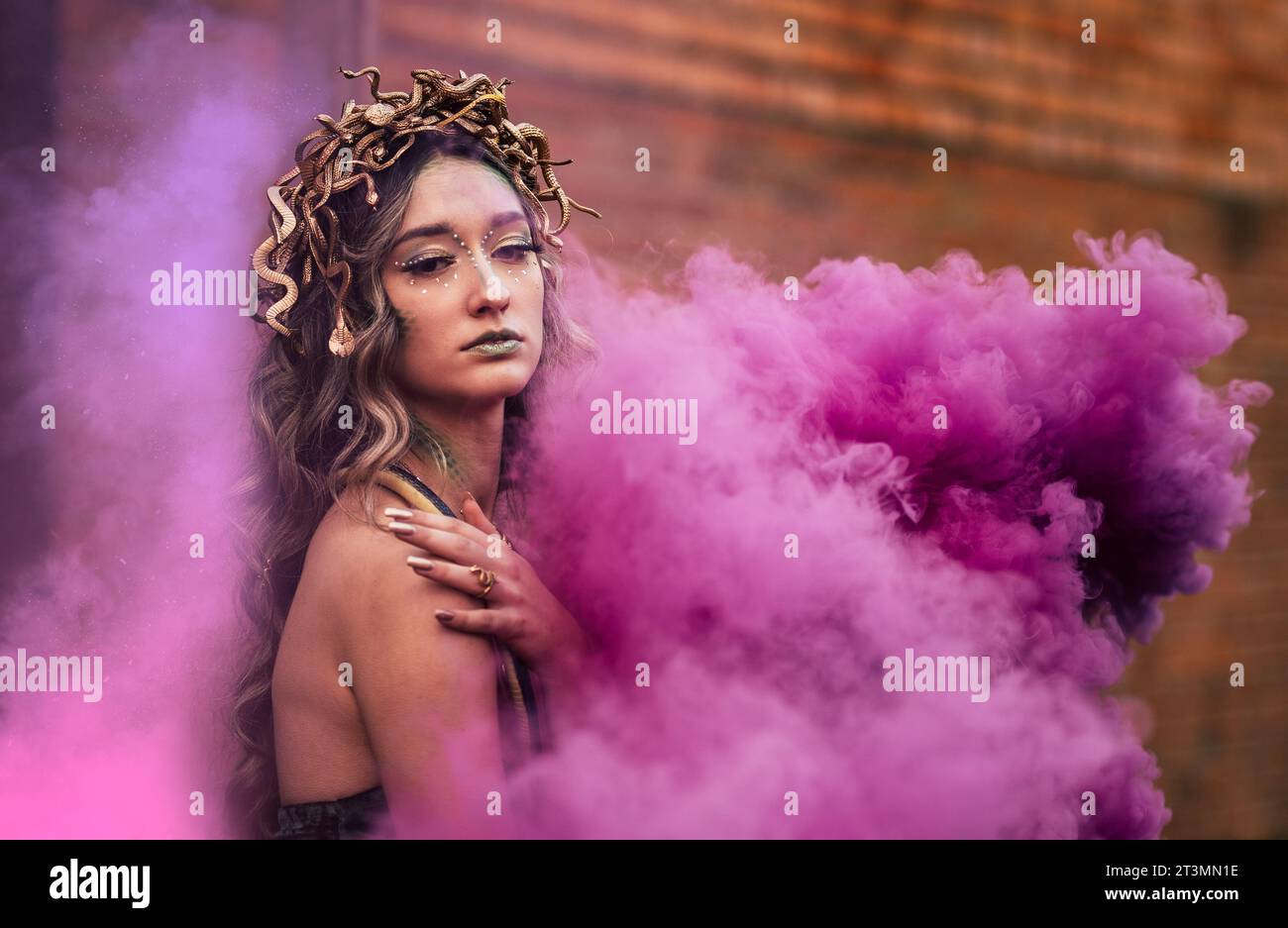 Female Medusa Spooky with Pink Smoke Stock Photo - Alamy