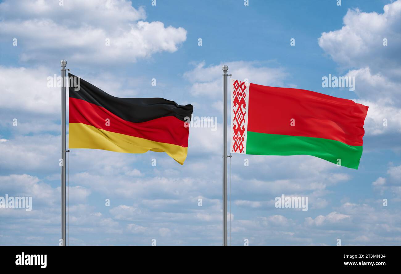 Belarus and Germany flags waving together in the wind on blue cloudy ...