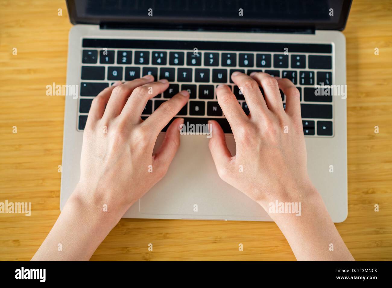 Photo top view of arms typing write code project management journalism ...