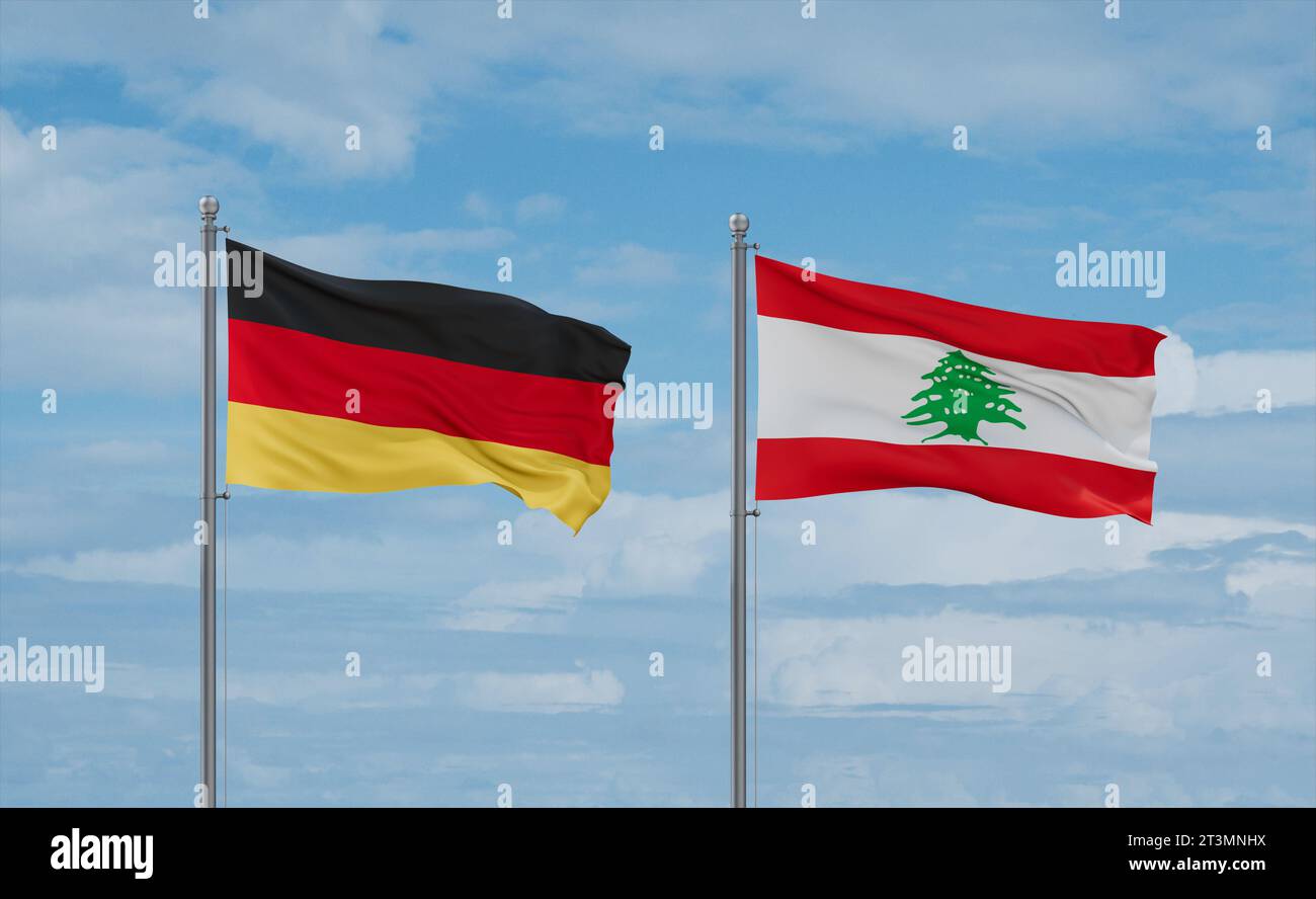 Lebanon and Germany flags waving together in the wind on blue cloudy ...