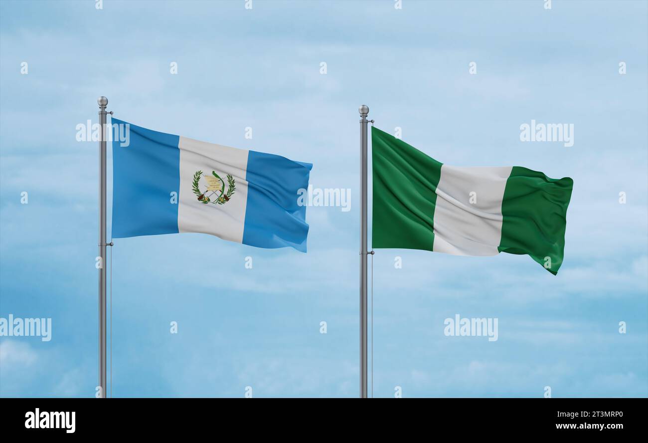 Nigeria and Guatemala flags waving together on blue cloudy sky, two ...