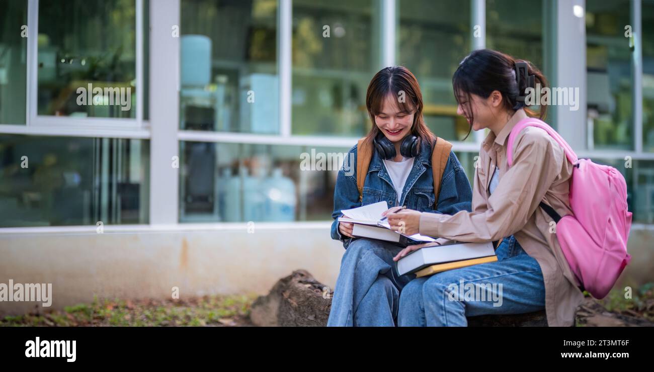 Happy young student chat with each other after class. girls wear casual ...