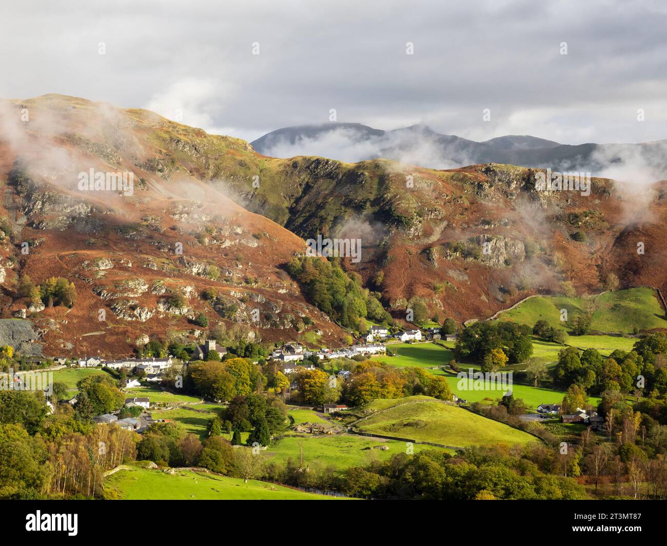 Cloud and mist around the fells above Langdale Valley looking down on ...