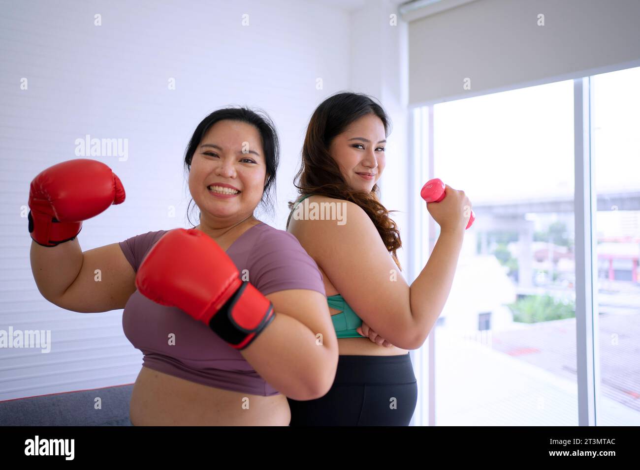 Plus size woman work out at home. Health care and lifestyle concept ...