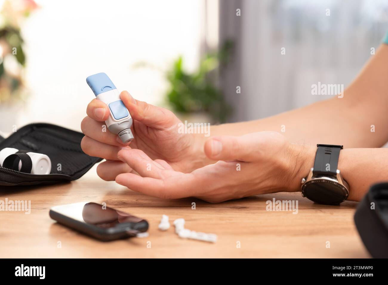 Diabetes doing sugar blood test, using glucometer and lancet Stock ...