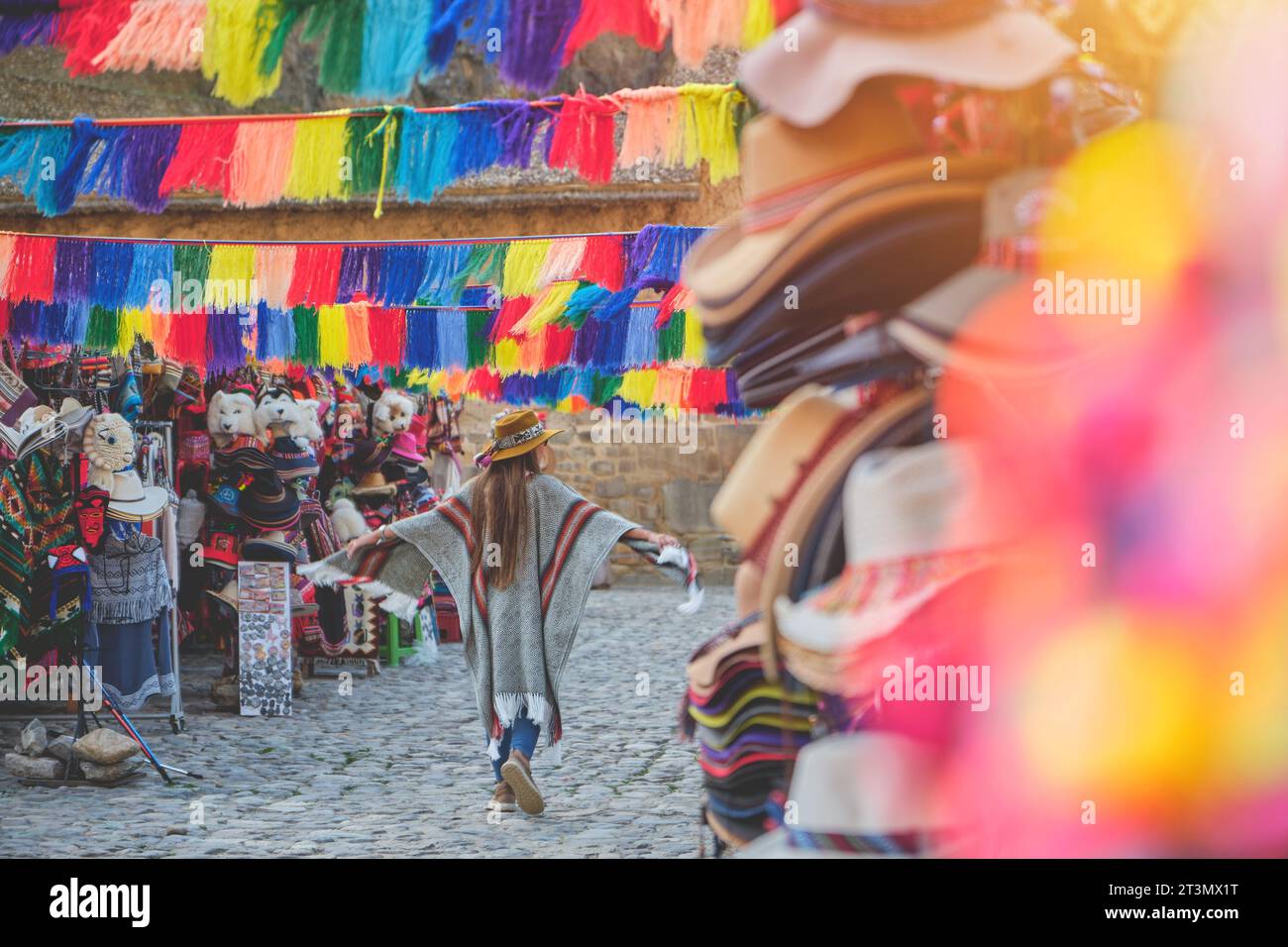 Traveler hipster girl in hat with backpack exploring market of ...