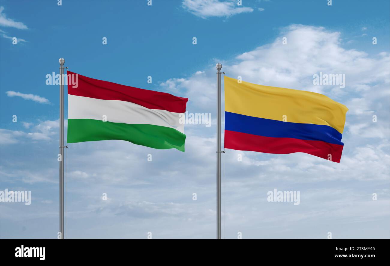 Colombia and Hungary flags waving together in the wind on blue cloudy sky, two country ...