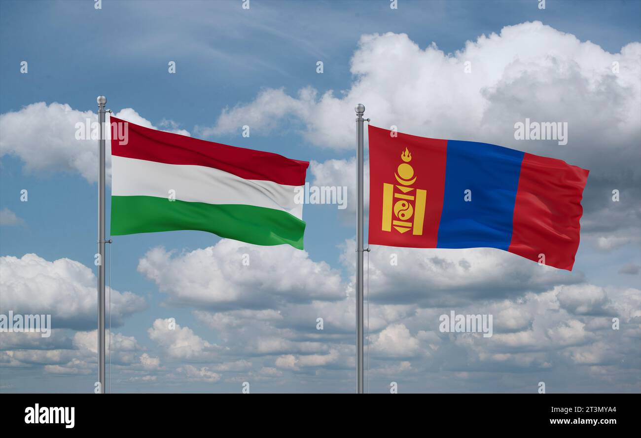Mongolia and Hungary flags waving together in the wind on blue cloudy ...