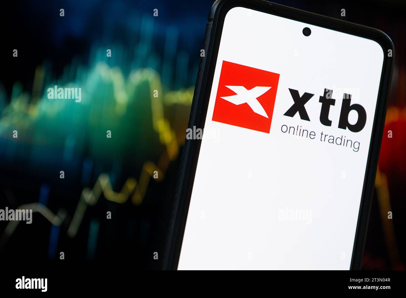 In this photo illustration Xtb Online Trading logo seen displayed on a ...