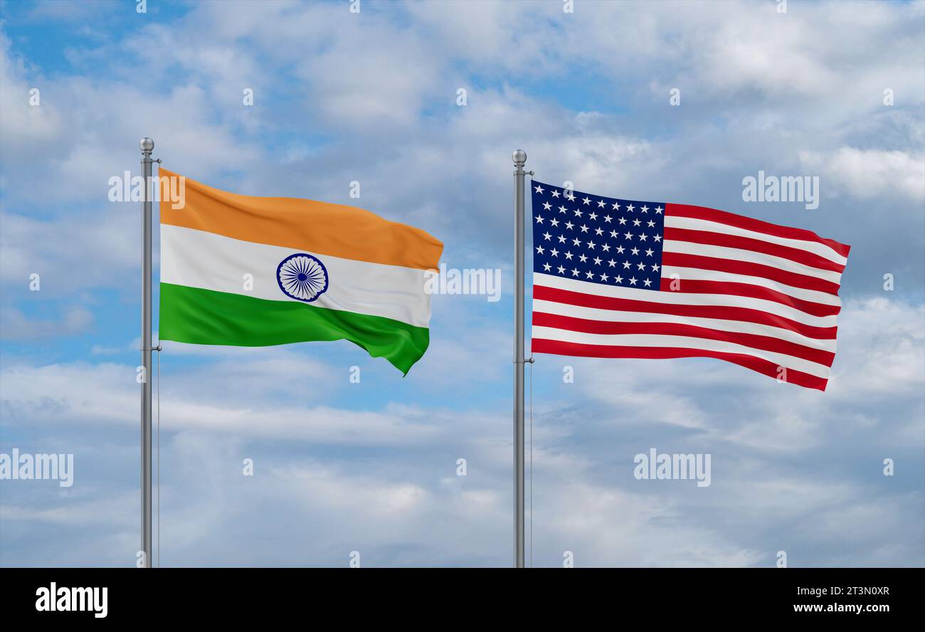USA and India flags waving together in the wind on blue cloudy sky, two ...