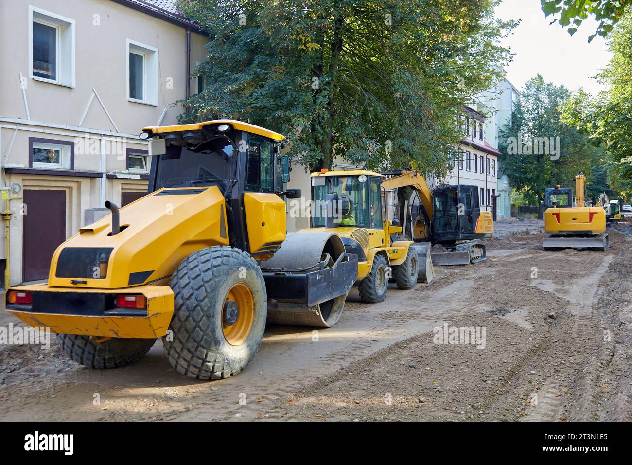 Road construction equipment: excavators, asphalt rollers, bulldozers on ...