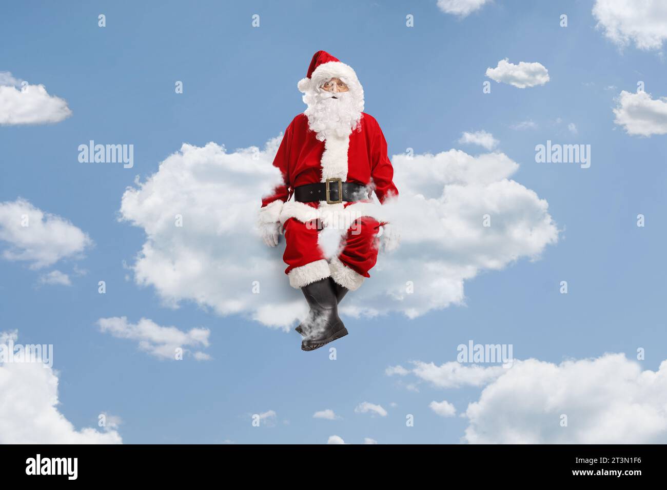 Santa claus floating on clouds up in the sky Stock Photo - Alamy