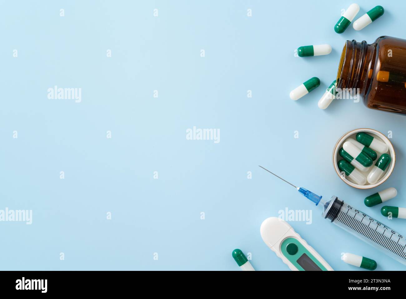 Taking medicine design concept, top view of capsule pills spilled over ...