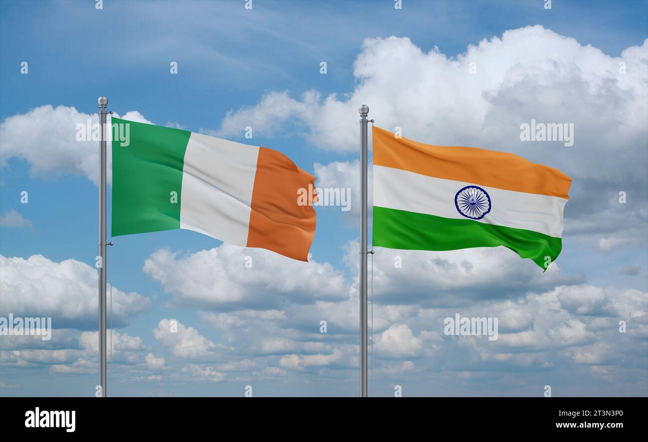 India and Ireland flags waving together on blue cloudy sky, two country ...