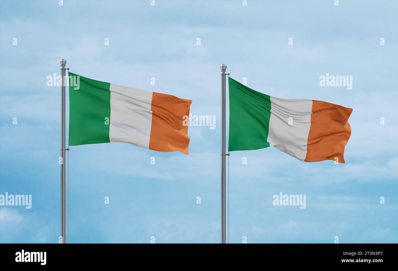 Two Ireland flags waving together in the wind on blue cloudy sky, two ...