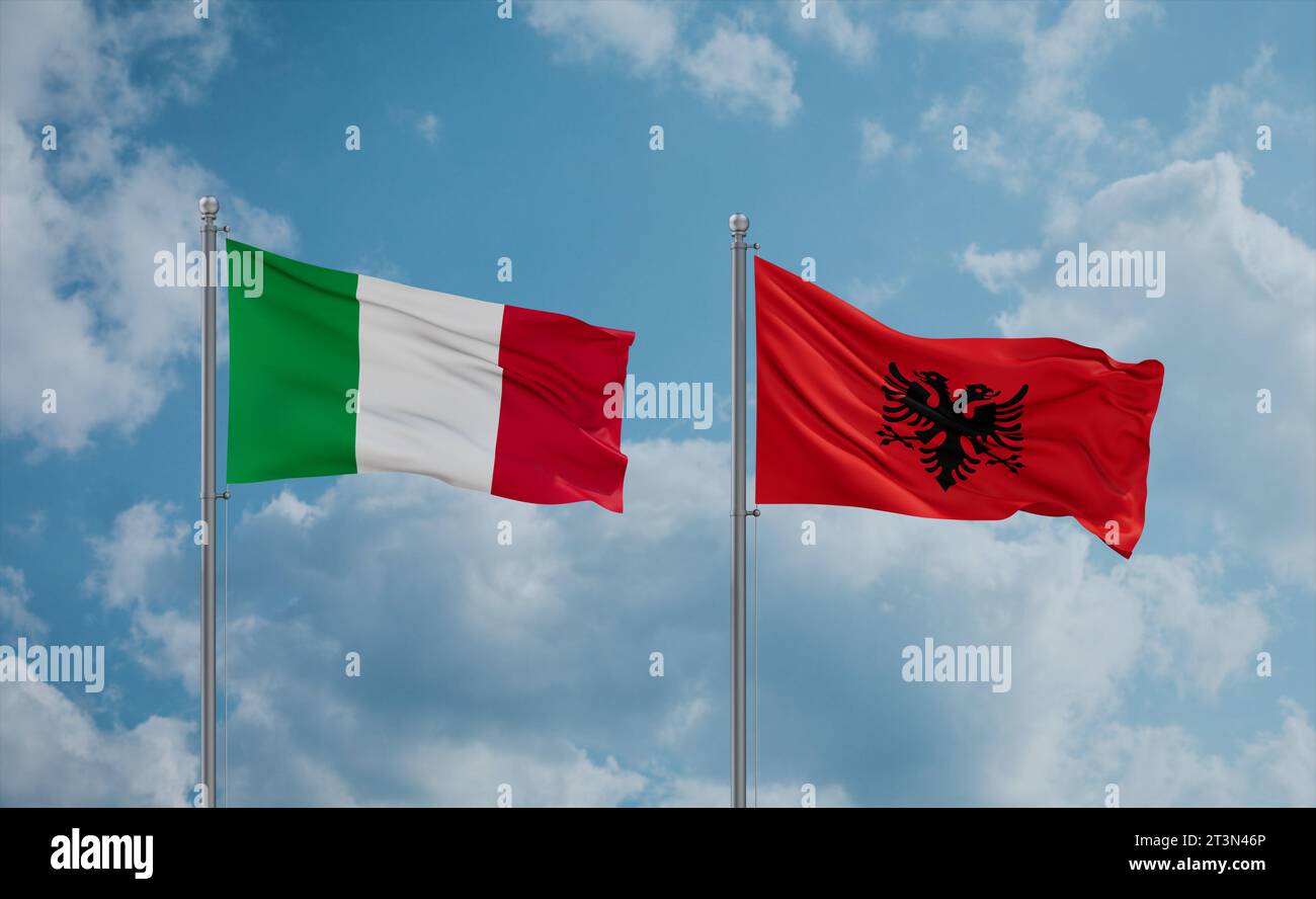 Italy and Albania flags waving together in the wind on blue cloudy sky ...