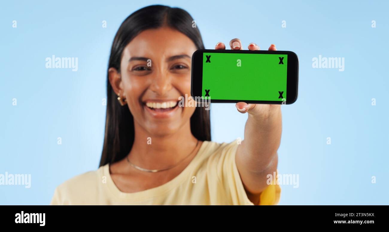 Cellphone green screen, studio portrait and happy woman show web ...
