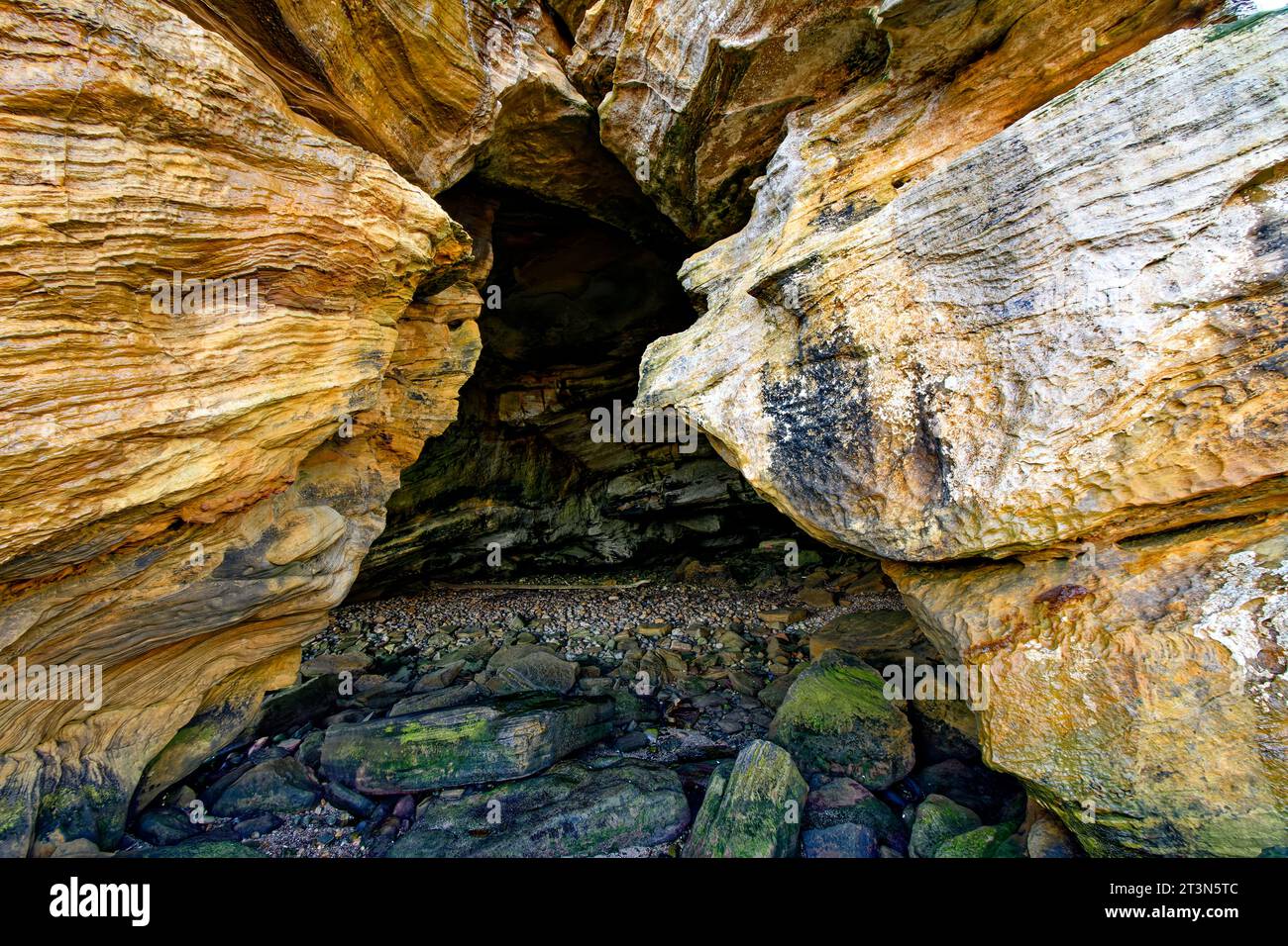 Hopeman Moray Coast Scotland golden sandstone rocks and entrance to a ...