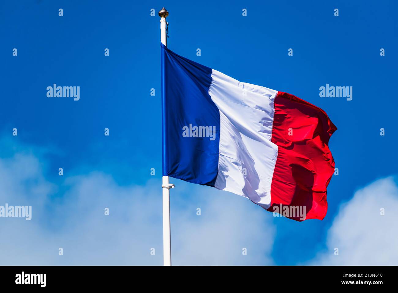French tricolor flag fluttering with strong wind and blue sky Stock ...