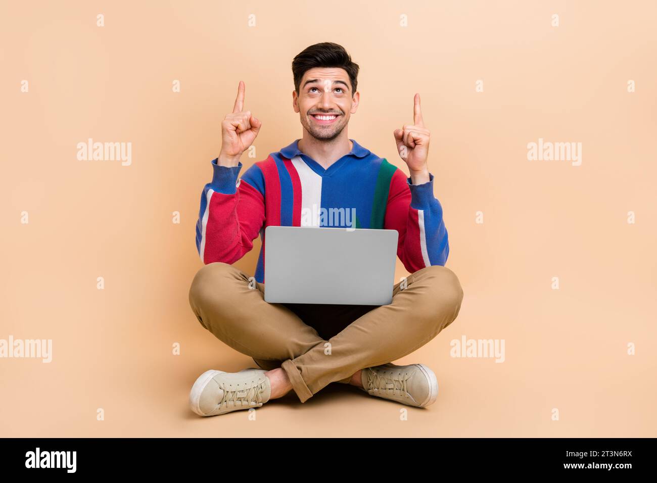 Full length photo of young shopaholic guy pointing fingers above his ...