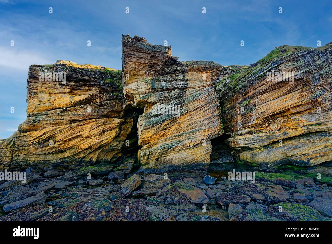 Hopeman Moray Coast Scotland two dark entrances into a large cave ...