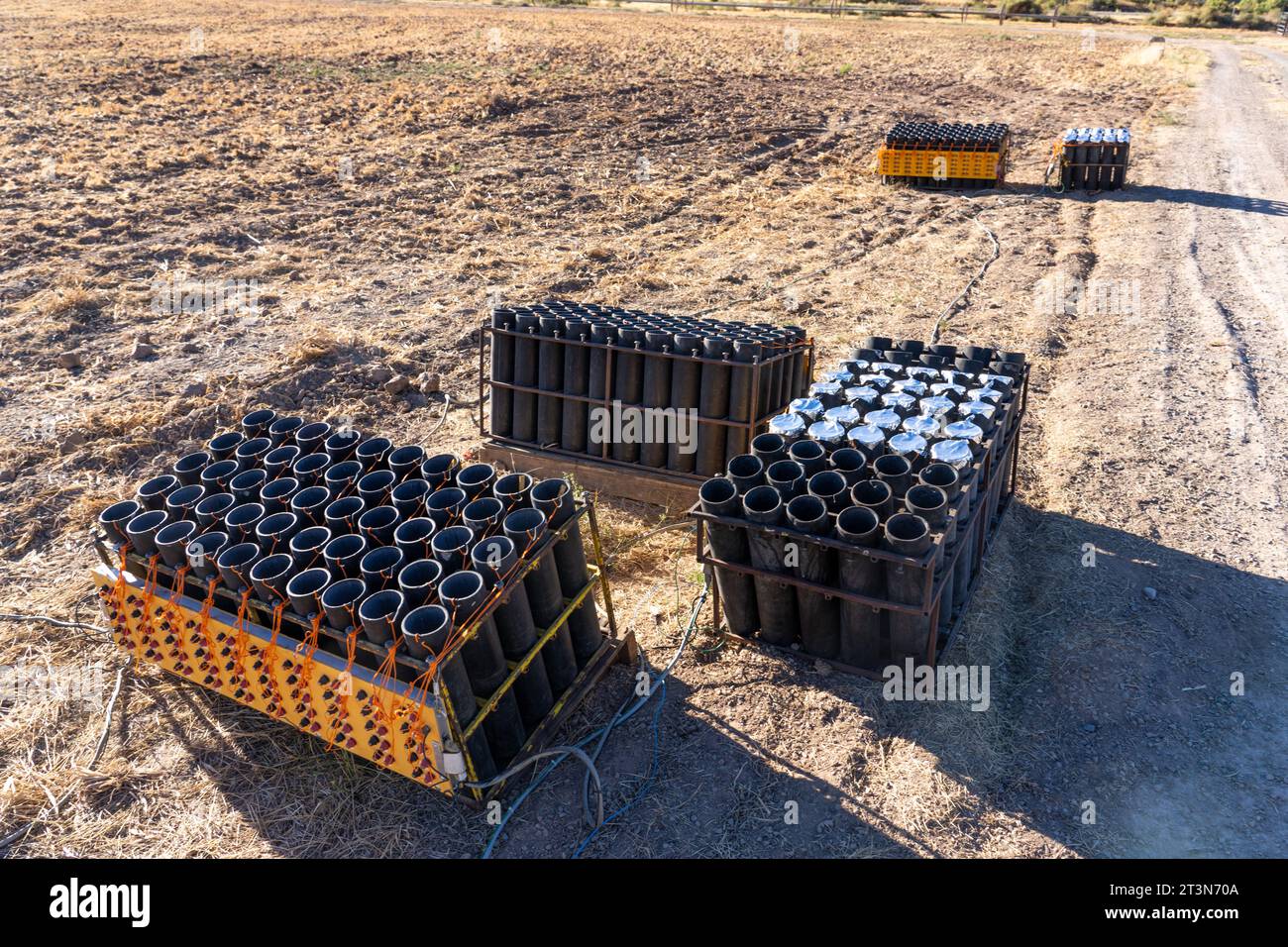 A battery of launchers for 4" pyrotechnic shells being prepared for a ...