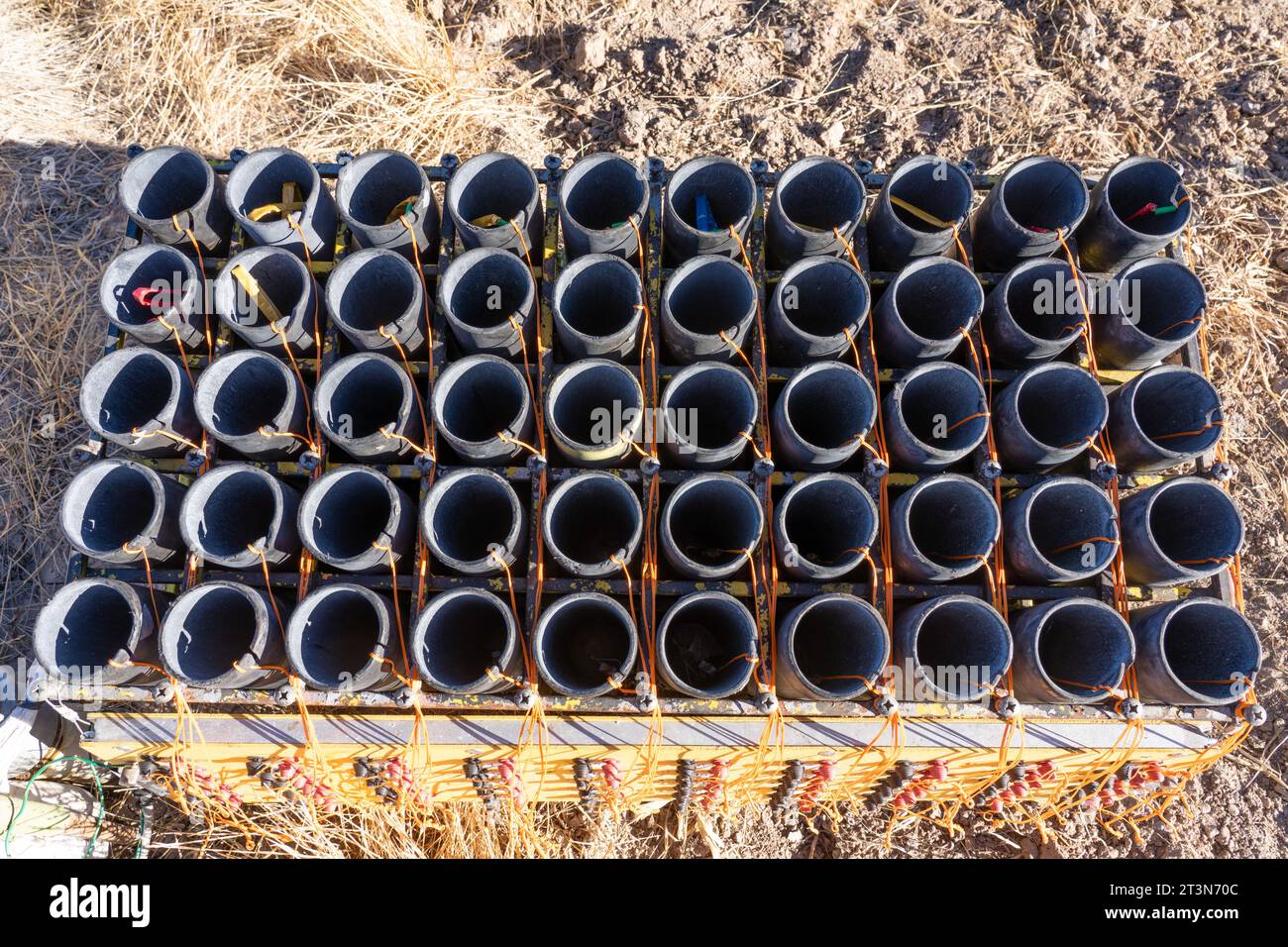 A battery of launchers for 4" pyrotechnic shells being prepared for a ...
