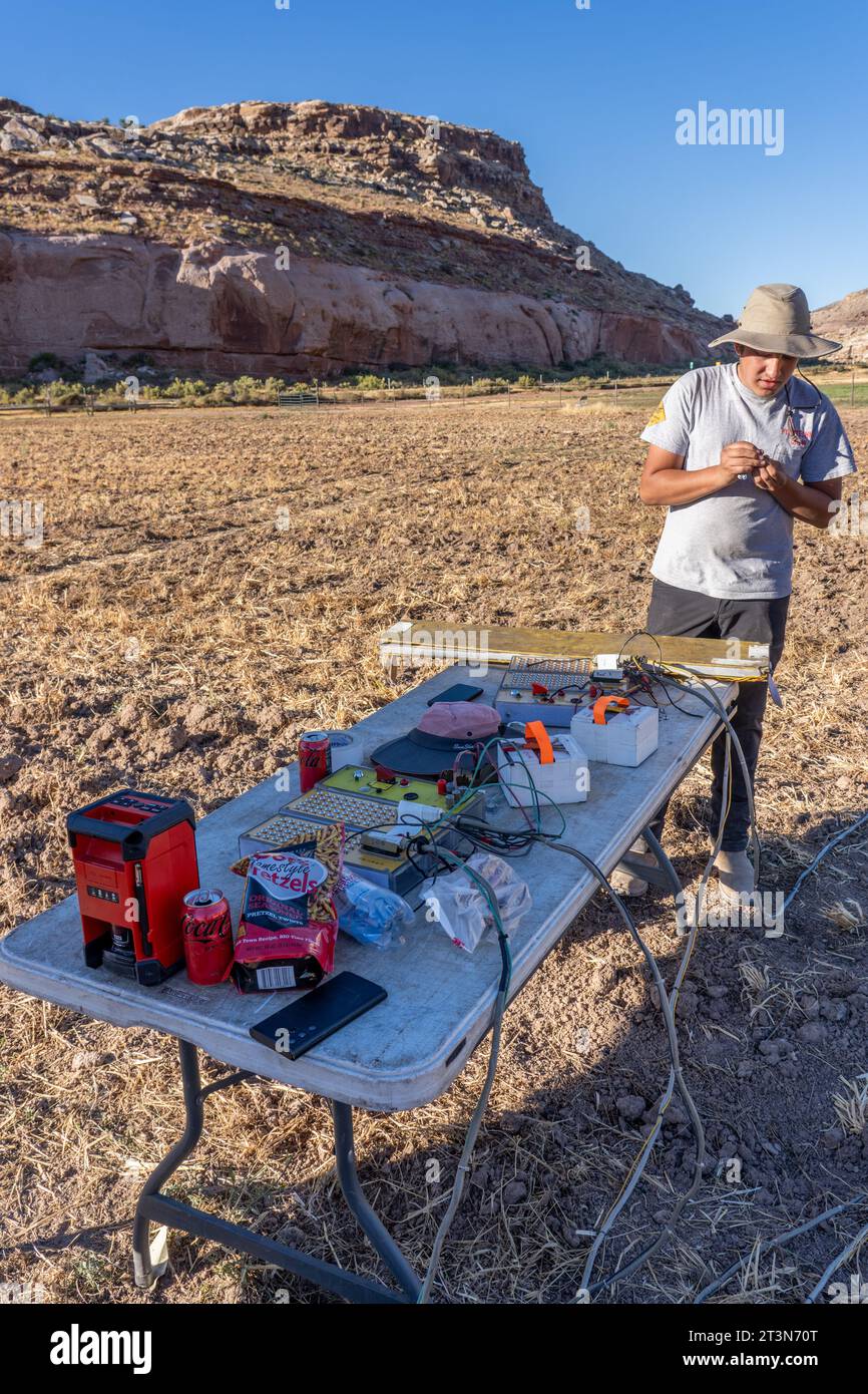 A technician sets up the controllers for fireworks launchers for a ...