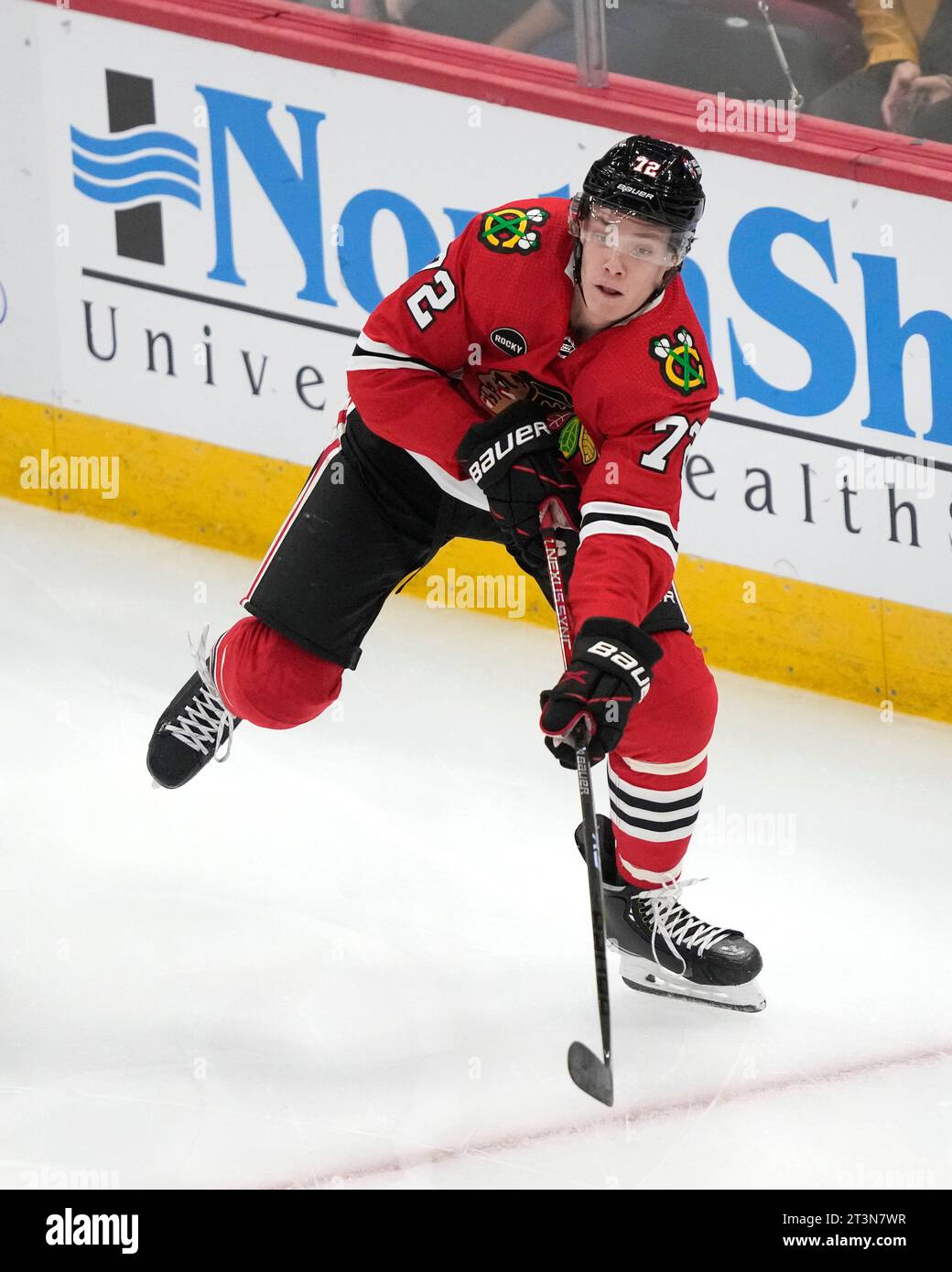 Chicago Blackhawks' Alex Vlasic watches his pass during an NHL hockey ...