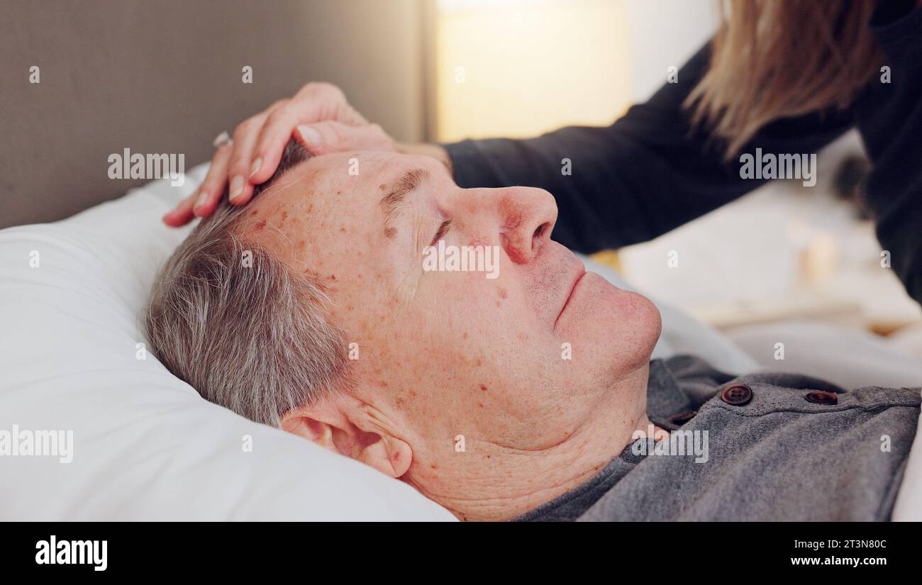 Senior woman caring her husband in bed with love, care and marriage at ...