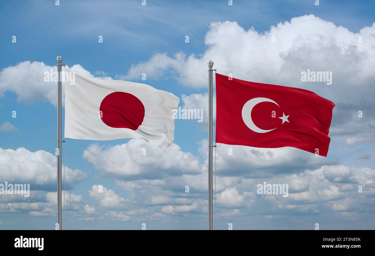 Republic of Turkey and Japan flags waving together in the wind on blue ...