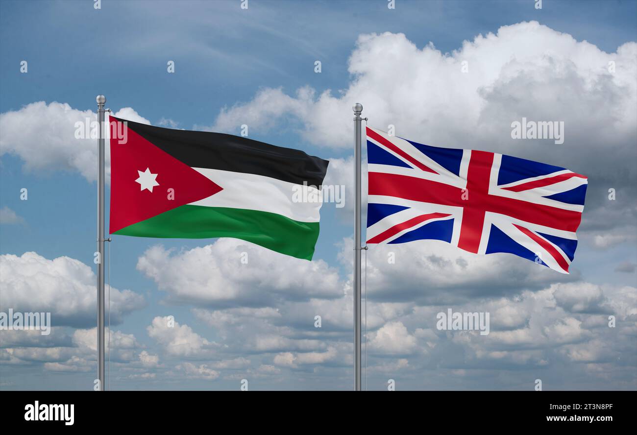 United Kingdom and Jordan flags waving together in the wind on blue cloudy sky, two country ...