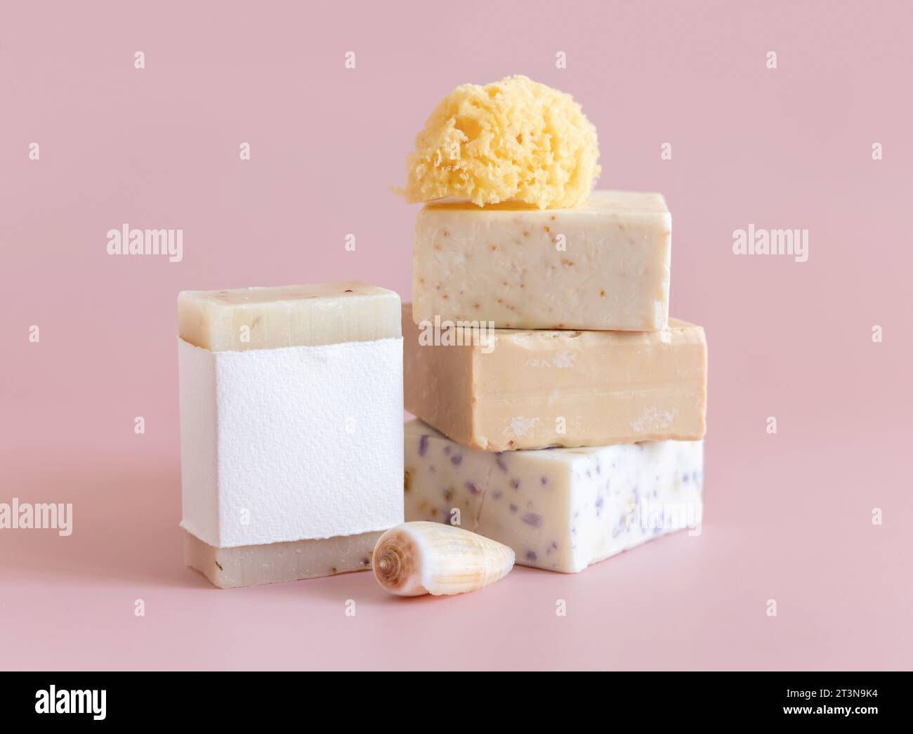 Beige handmade soap bars with blank label, natural sponge and seashell ...