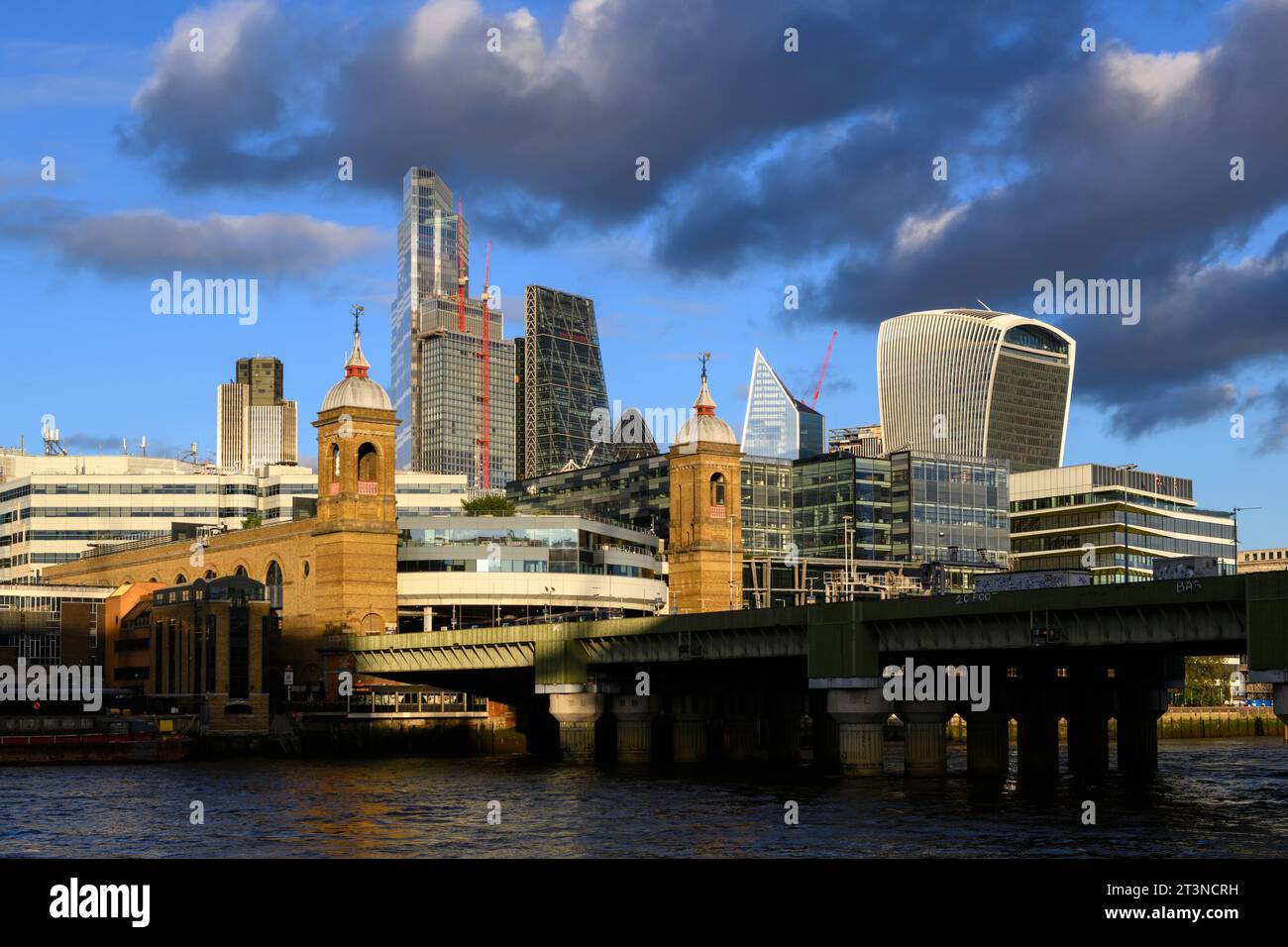 The river side view of Cannon Street railway bridge and station with ...