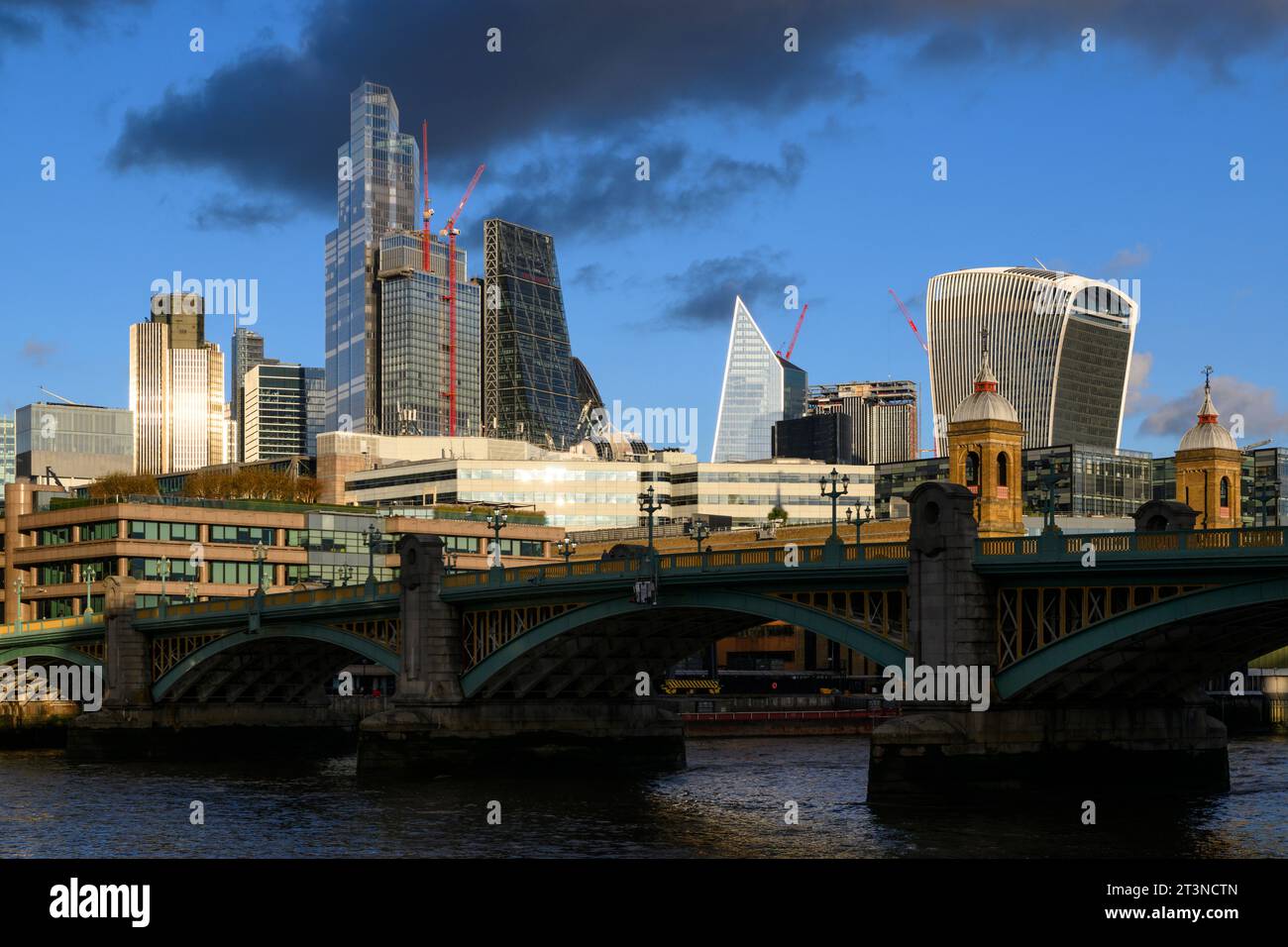 Southwark Bridge over the River Thames with skyscrapers of the City of ...