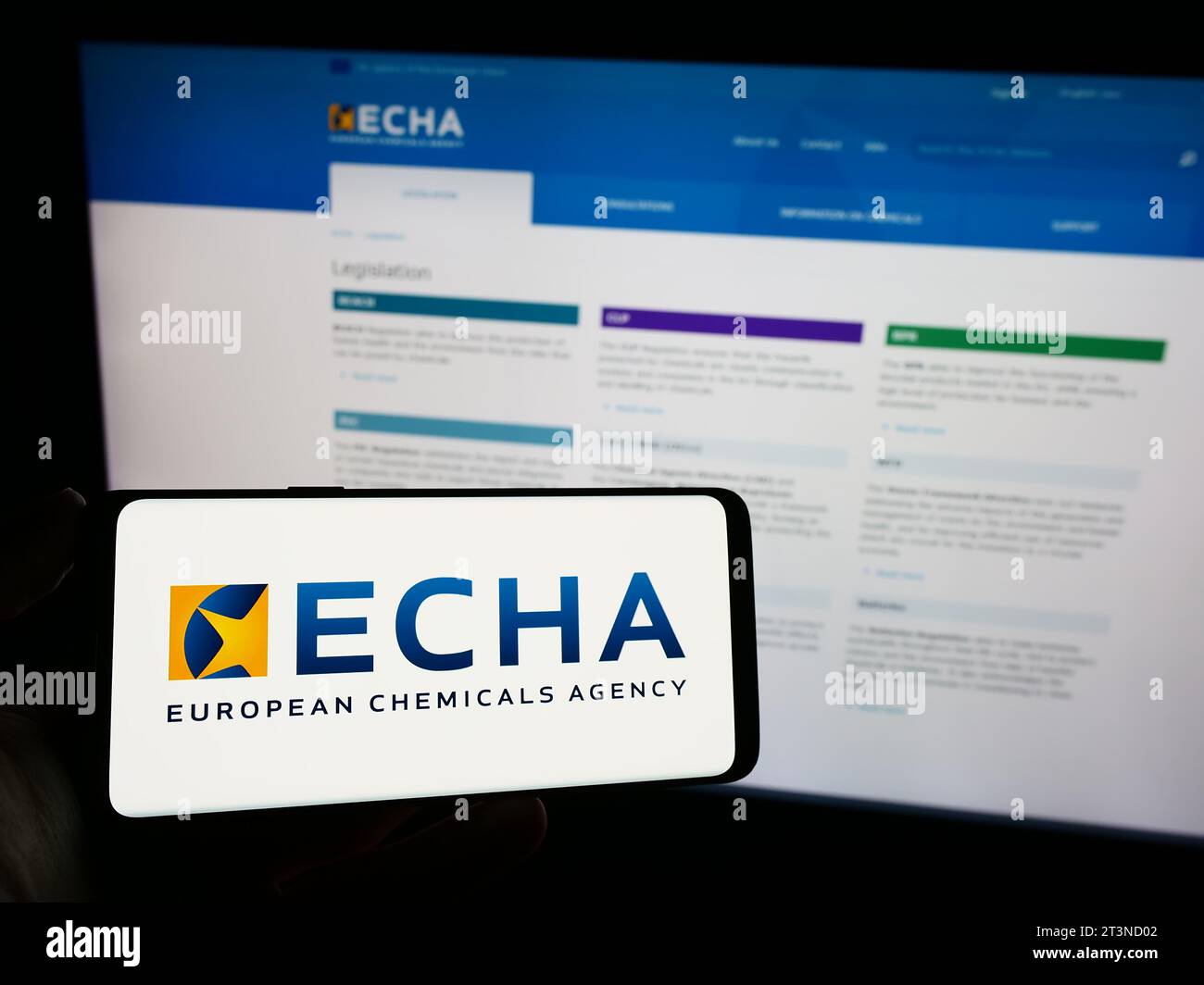 Person holding mobile phone with logo of EU institution European ...