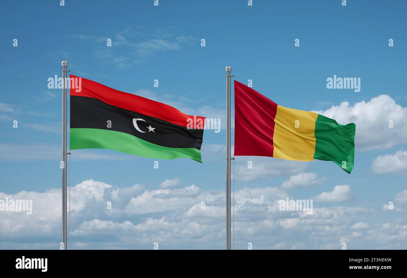 Republic of Guinea and Libya flags waving together on blue cloudy sky ...