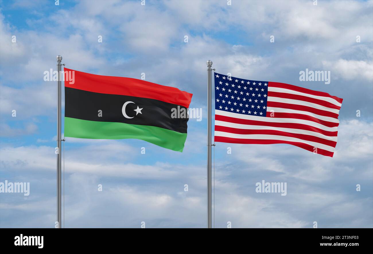 USA and Libya flags waving together in the wind on blue cloudy sky, two ...